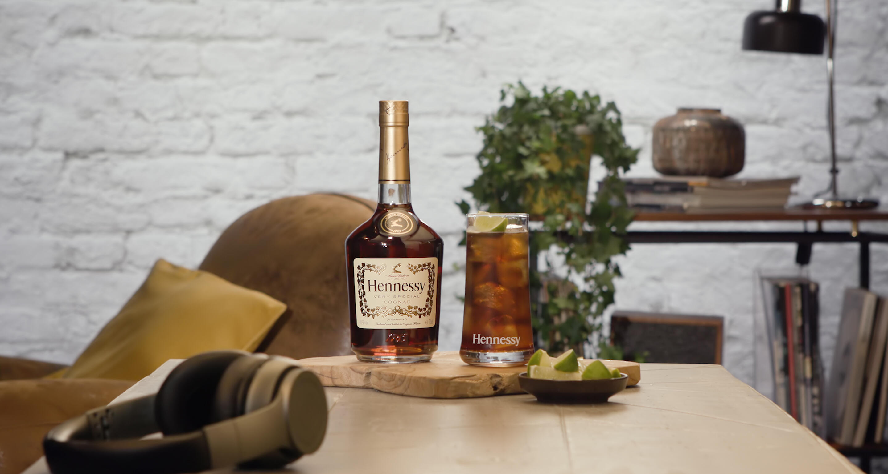 Alcoholic cocktail Hennessy Cola with lime wedge - Hennessy